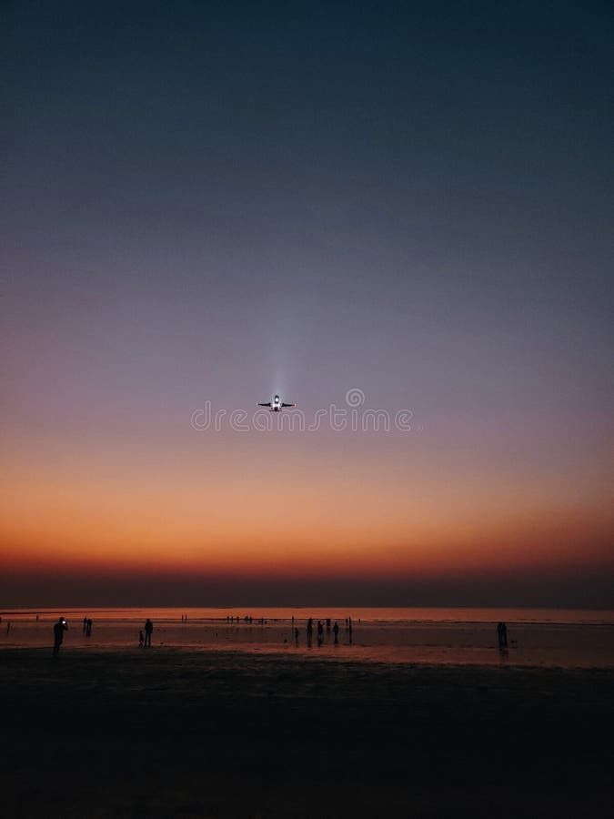 Beach Sunset View while Strolling Around in Evening with Airplane in ...