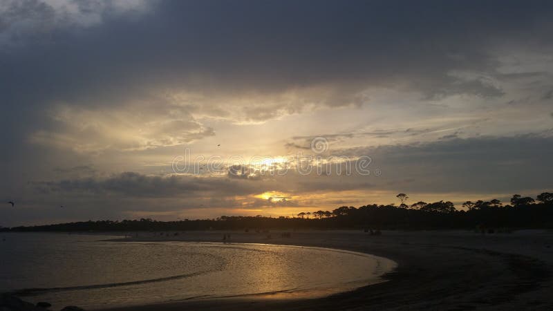 Beach sunset stock image. Image of water, waves, beach - 117475195