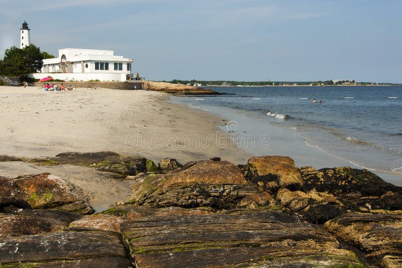 Beach Surrounds Lighthouse in Connecticut Stock Photo - Image of ...
