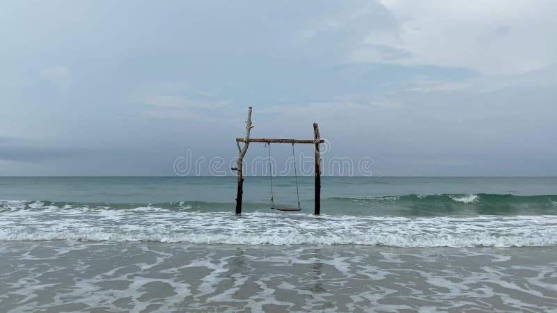 Beach Swing and Watching Ocean Waves. Carefree Summer Moment at Ocean ...