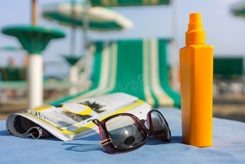 On the Beach Taking the Sun Stock Image - Image of screen, care: 43832795