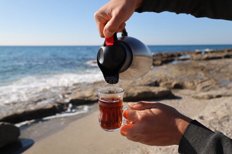 Beach tea thermos stock image. Image of leisure, clothes - 353991527
