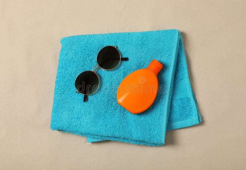 Beach Towel, Sunglasses and Sunscreen on Sand, Top View Stock Photo ...