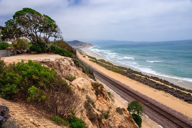 A Beach with a Train Track Running Along the Shore Stock Photo - Image ...