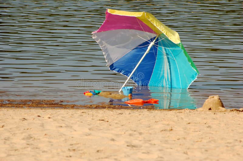 Large Colourful Umbrella on a Sunny Beach in Spain Stock Photo - Image ...