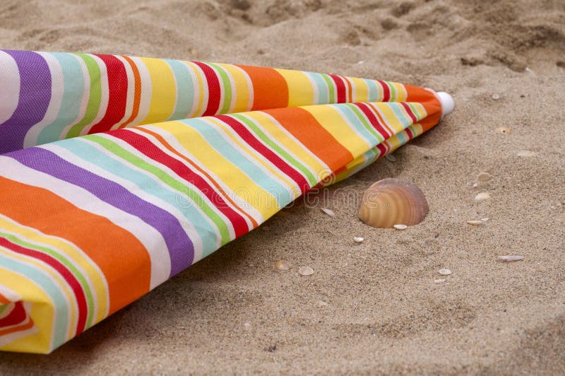 Beach umbrella on the sand stock image. Image of summer - 87515675