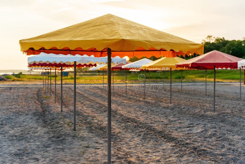Beach Umbrellas on an Empty Sandy Beach during Sunset Stock Photo ...