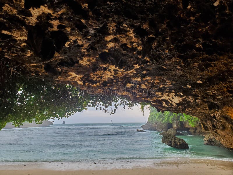 Beach under large reef stock photo. Image of coast, reef - 265399058