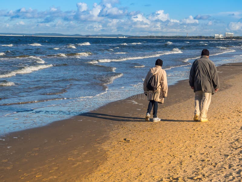 Beach Walk stock image. Image of standing, wearing, beach - 57039161