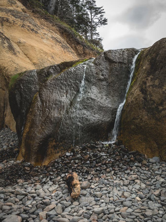 Beach Waterfall and Caves at Hug Point State Park in Oregon. Stock ...