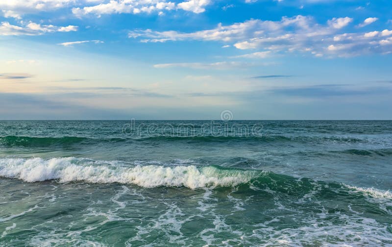 Beach with a Wavy Beautiful Sea Stock Photo - Image of reflection ...