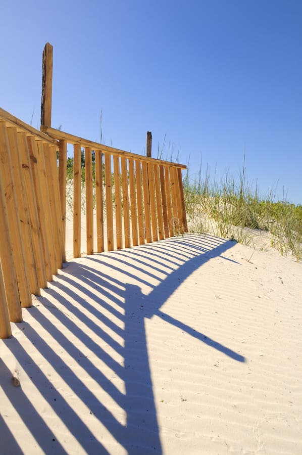 Fence and Shadow on Beach stock photo. Image of pensacola - 4630970