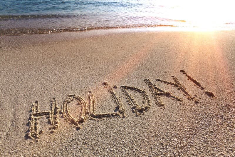On a Beach it is Written Holiday Stock Image - Image of holiday, beach ...