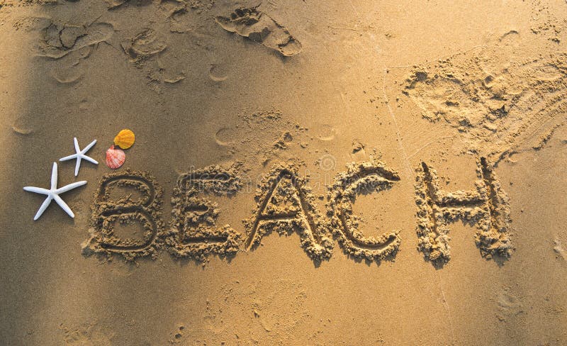 Beach written in the sand stock photo. Image of breeze - 122798074