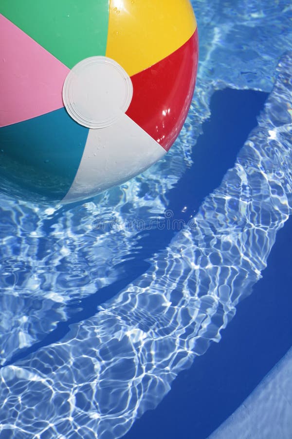 Beachball in a Beautiful Blue Swimming Pool Stock Image - Image of swim ...
