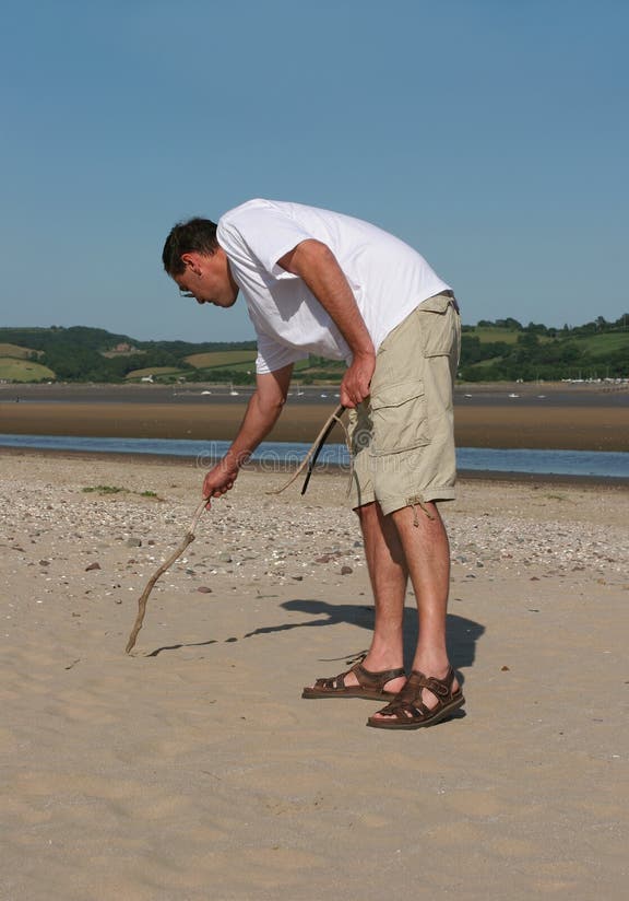 The Beachcomber stock image. Image of beach, bending, human - 1110939