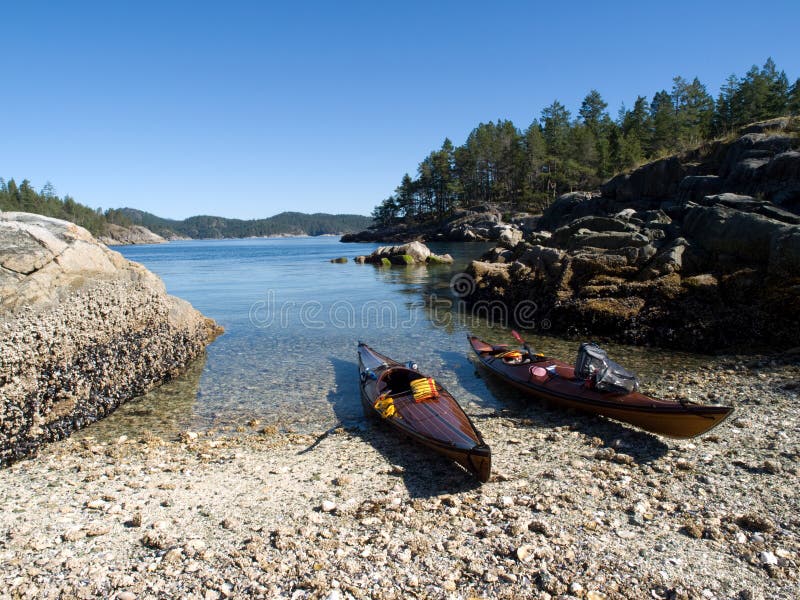 Beached Kayaks on Narrow Inlet Stock Image - Image of kayaking, kayaks ...