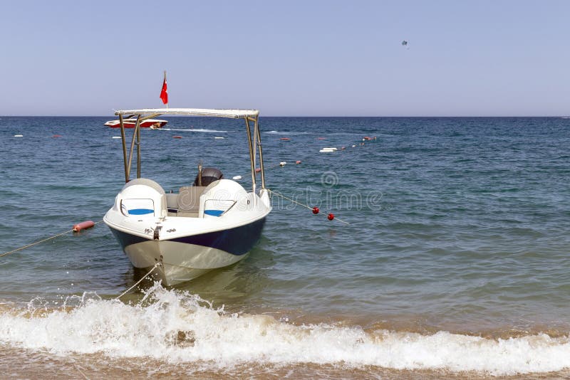 A Beached Speedboat Against the Sea. Stock Image - Image of nautical ...