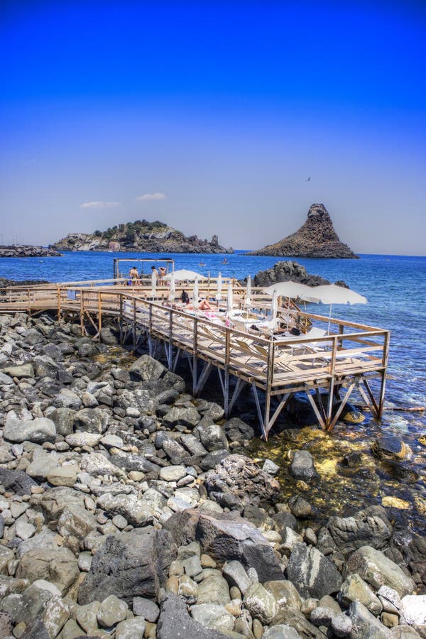 The beaches of Aci Trezza stock image. Image of rock - 136705283