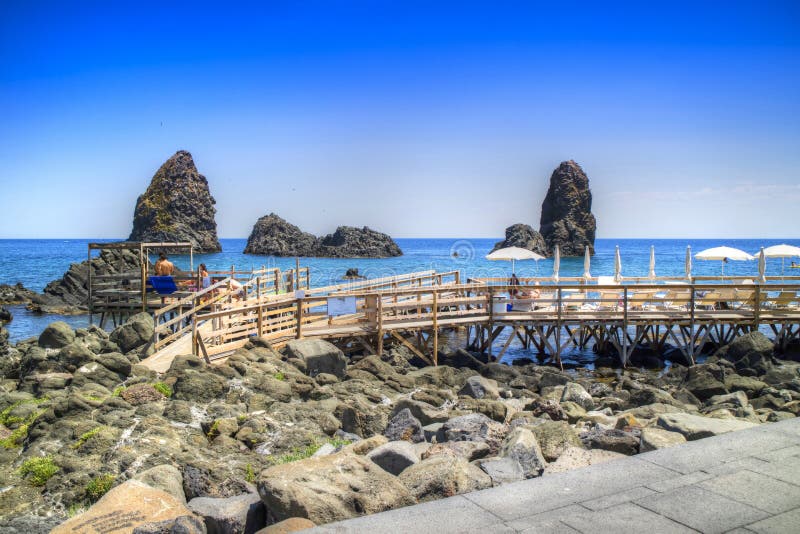 The beaches of Aci Trezza stock image. Image of summer - 136705071