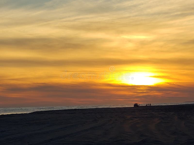 Beachy Sunset Emerald Isle stock image. Image of fishing - 173669923
