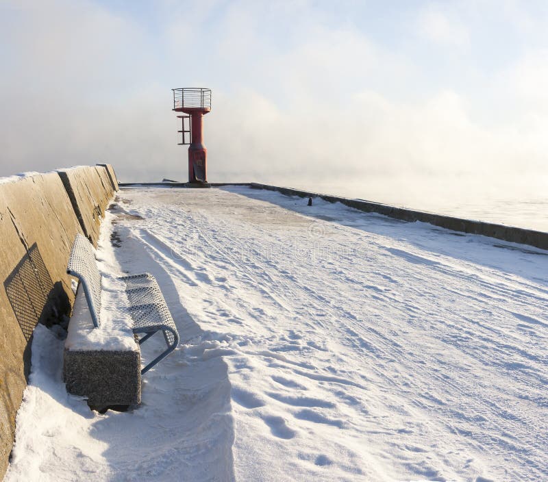 Beacon and Bench on Snowy Mole Stock Image - Image of snow, seasonal ...
