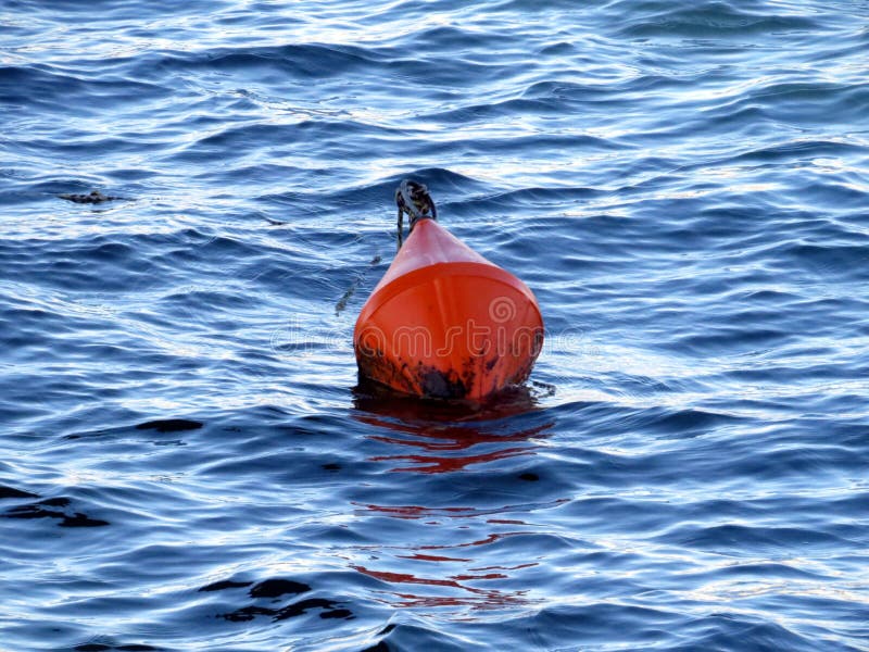 Beacon Floating on Blue Ocean As Guide Help Stock Photo - Image of ...