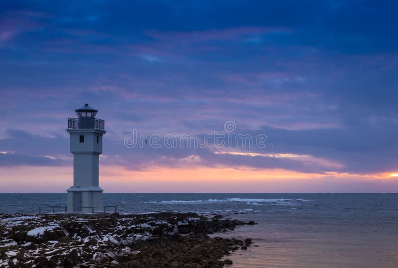 Beacon on an Ocean Coast during a Sunset. Iceland Stock Photo - Image ...