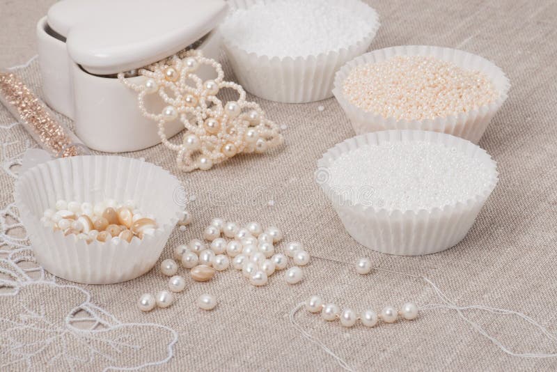 Beads Jewelry on Natural Linen Background. Hand Stock Image - Image of ...