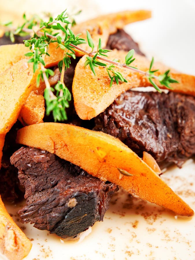 Beaf with quinces stock image. Image of meal, herbs, single - 48973113