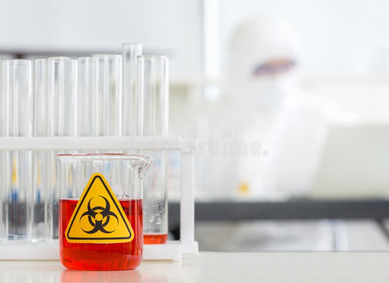 Beaker Contains Red Liquid Chemicals on a White Laboratory Table Stock ...