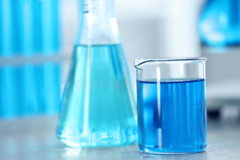 Beaker with Light Blue on Table in Laboratory. Space for Text Stock ...