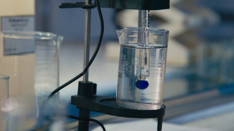 Beaker with Liquid in Testing Device in Laboratory Closeup Stock Video ...