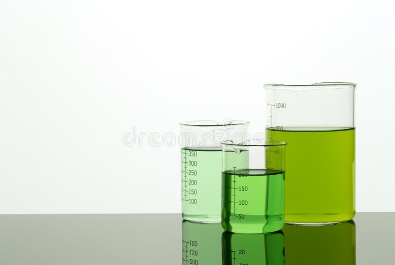Beakers of Different Size with Green Liquid. Copy Space. Stock Photo ...