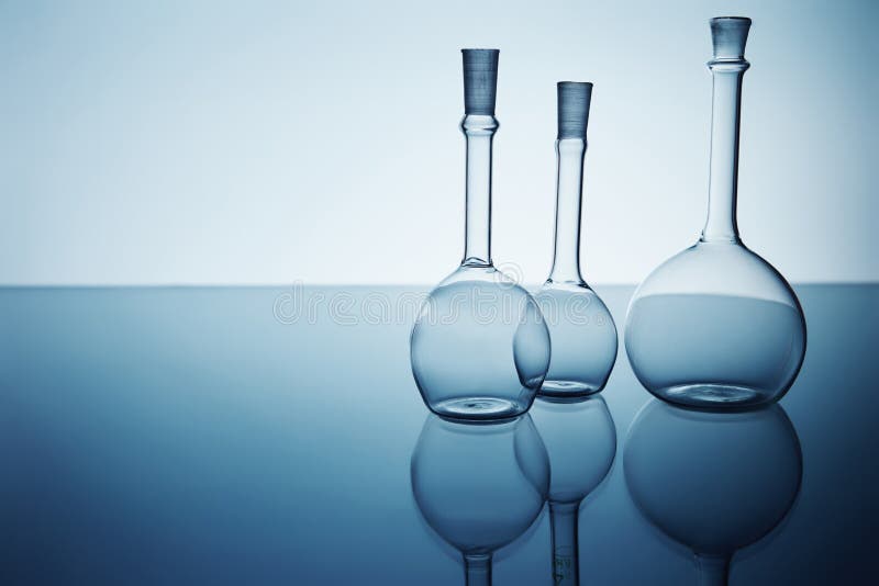 Three Beakers of Different Size with Green Liquid Stock Image - Image ...