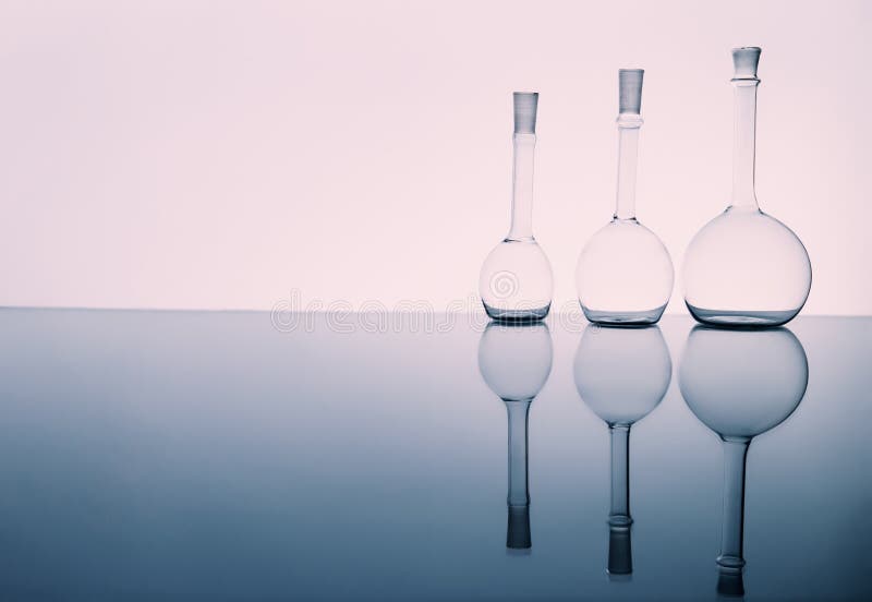 Three Beakers of Different Size with Green Liquid Stock Image - Image ...