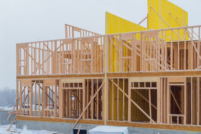 Beam is Attached Framework To Wooden Frame of a New Construction Home ...