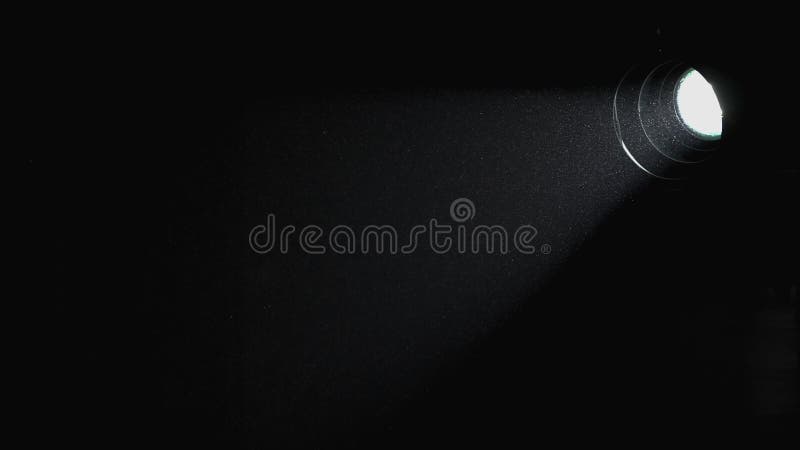 A Beam of Light from a Spotlight Illuminates a Dark Room. Dust ...