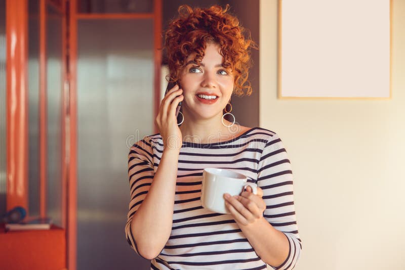Beaming Young Girl Having Coffee and Talking on the Phone Stock Image ...