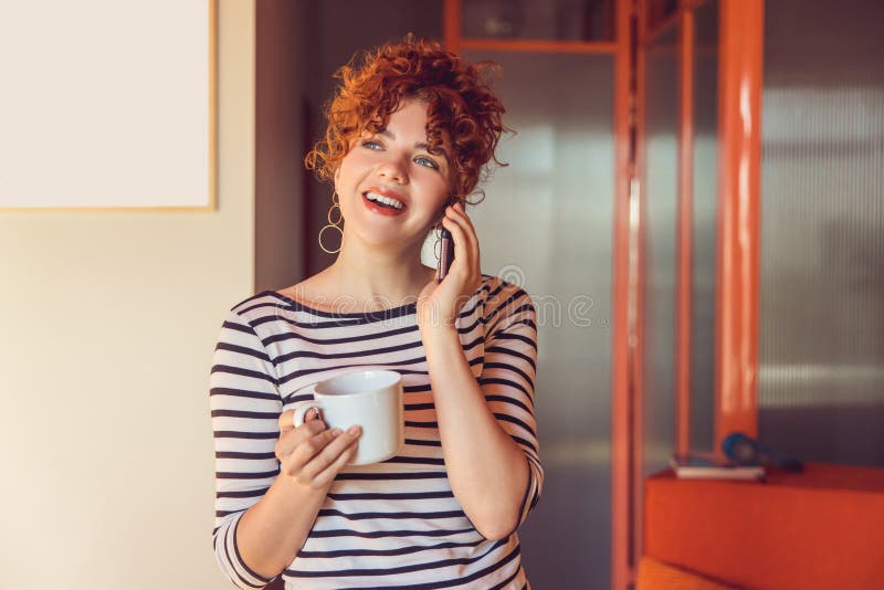 Beaming Young Girl Having Coffee and Talking on the Phone Stock Image ...