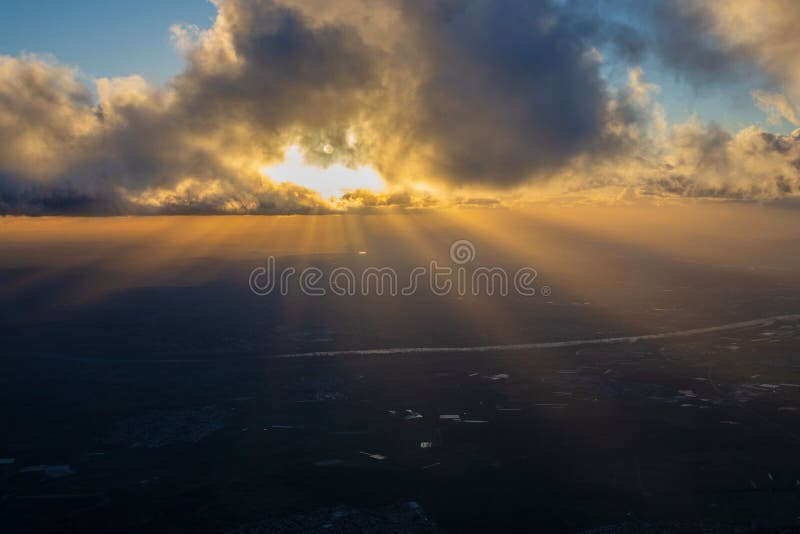 Beams of Sun Going through Cloud Onto Evening Land Stock Image - Image ...