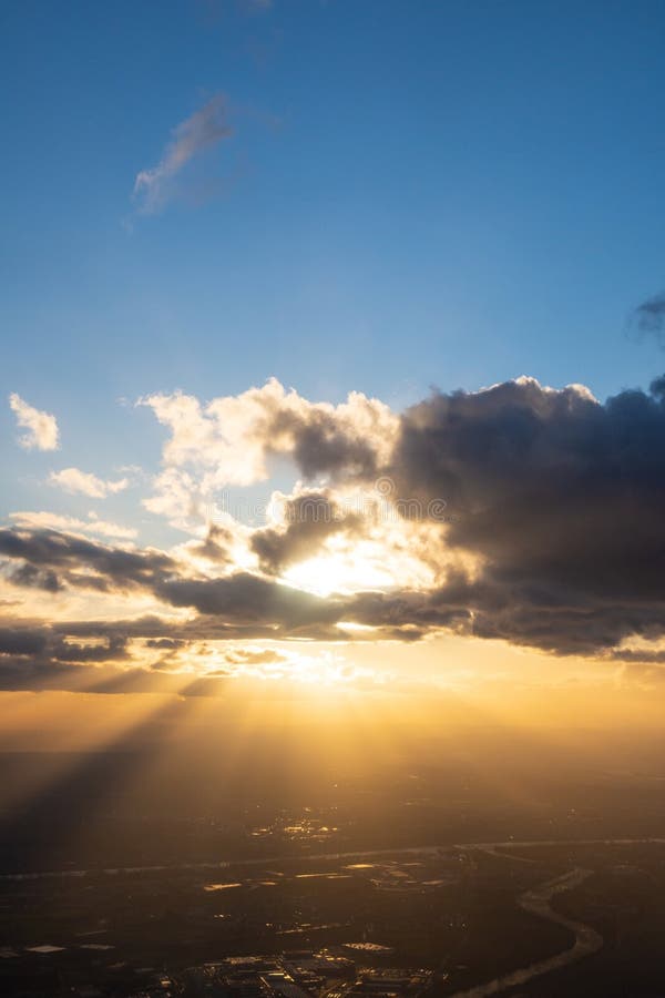 Beams of Sun Going through Cloud Onto Evening Land Stock Image - Image ...