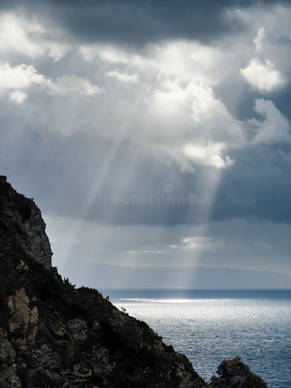 Beams of sun hit the ocean stock image. Image of serenity - 314842279