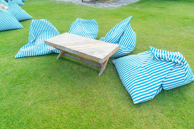 Bean Bag with Table on Grass in the Garden Stock Image - Image of light ...