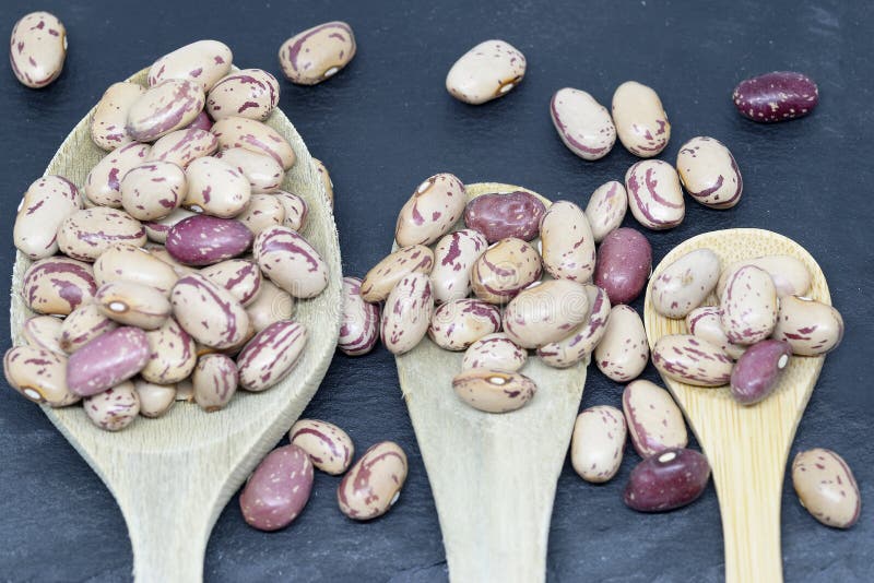 Bean Pint or Bean with Wooden Spoons on Slate Plate Stock Image - Image ...
