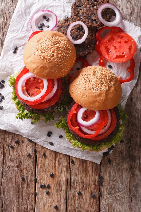 Bean Veggie Burgers with Vegetables Close-up. Vertical Top View Stock ...