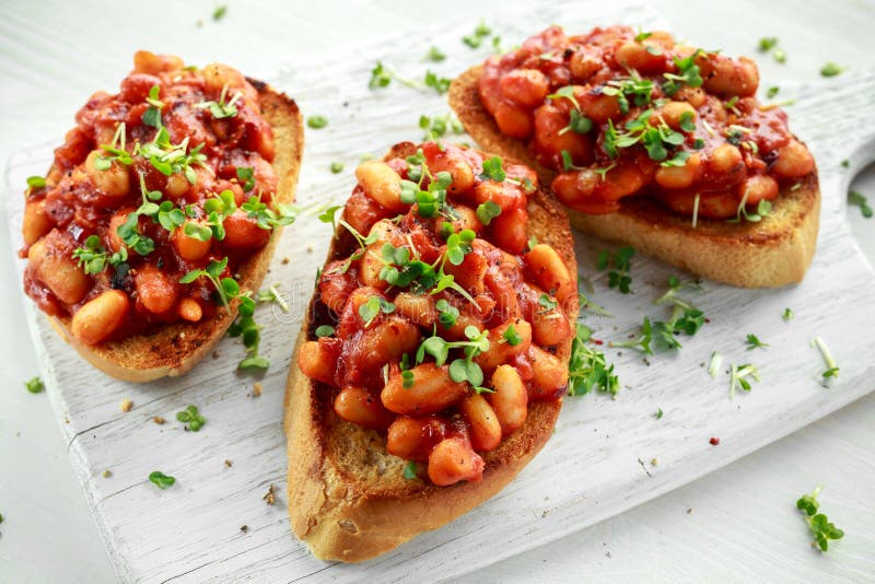 Beans Fried in Tomato Sauce on Toasted Bread with Cross Salad Sprinkle ...
