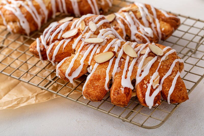Bear Claw Pastry on a Cooling Rack with Glaze and Almonds Stock Photo ...