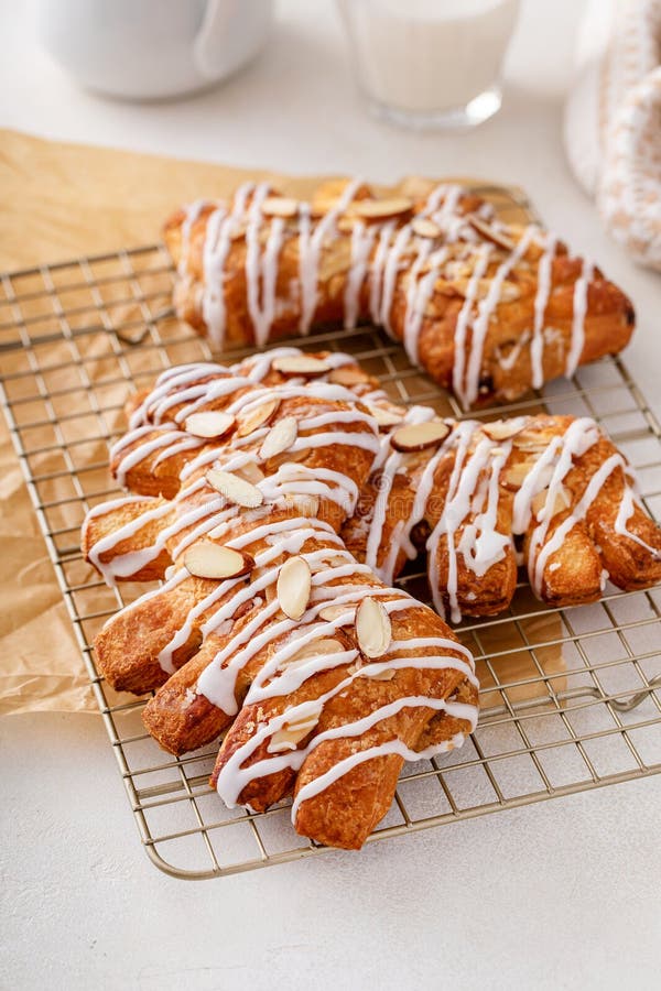 Bear Claw Pastry on a Cooling Rack with Glaze and Almonds Stock Photo ...