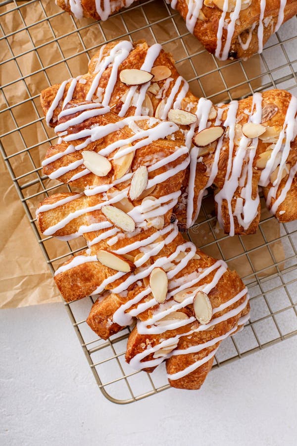 Bear Claw Pastry on a Cooling Rack with Glaze and Almonds Stock Image ...